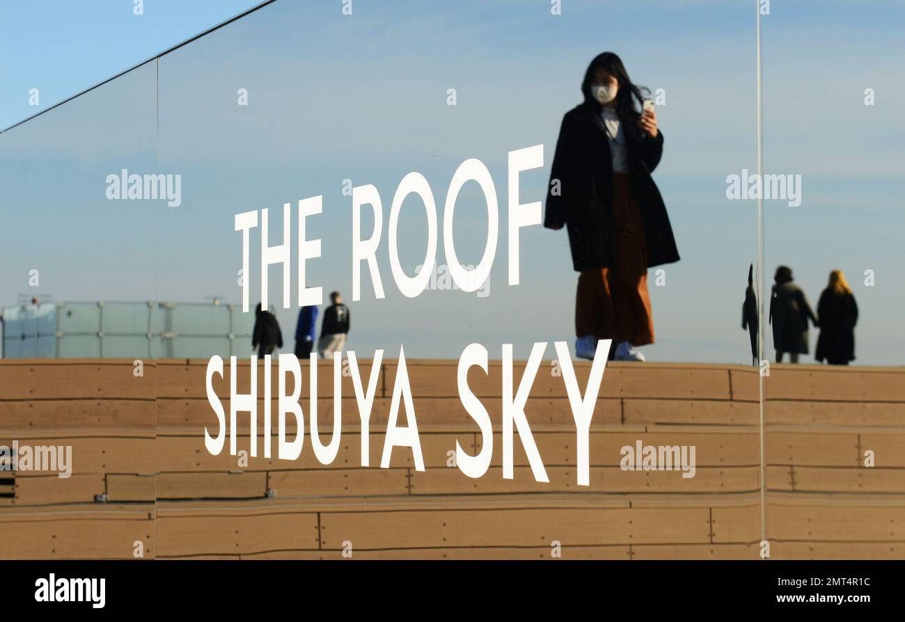 Tourist enjoying the views from the Shibuya Sky rooftop observation ...