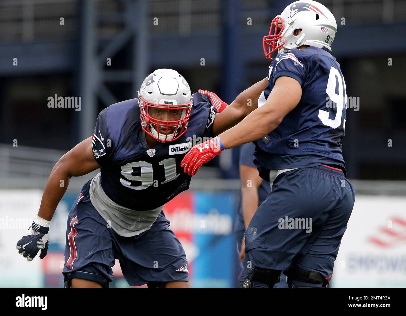 New England Patriots defensive ends Deatrich Wise, left, and Derek ...