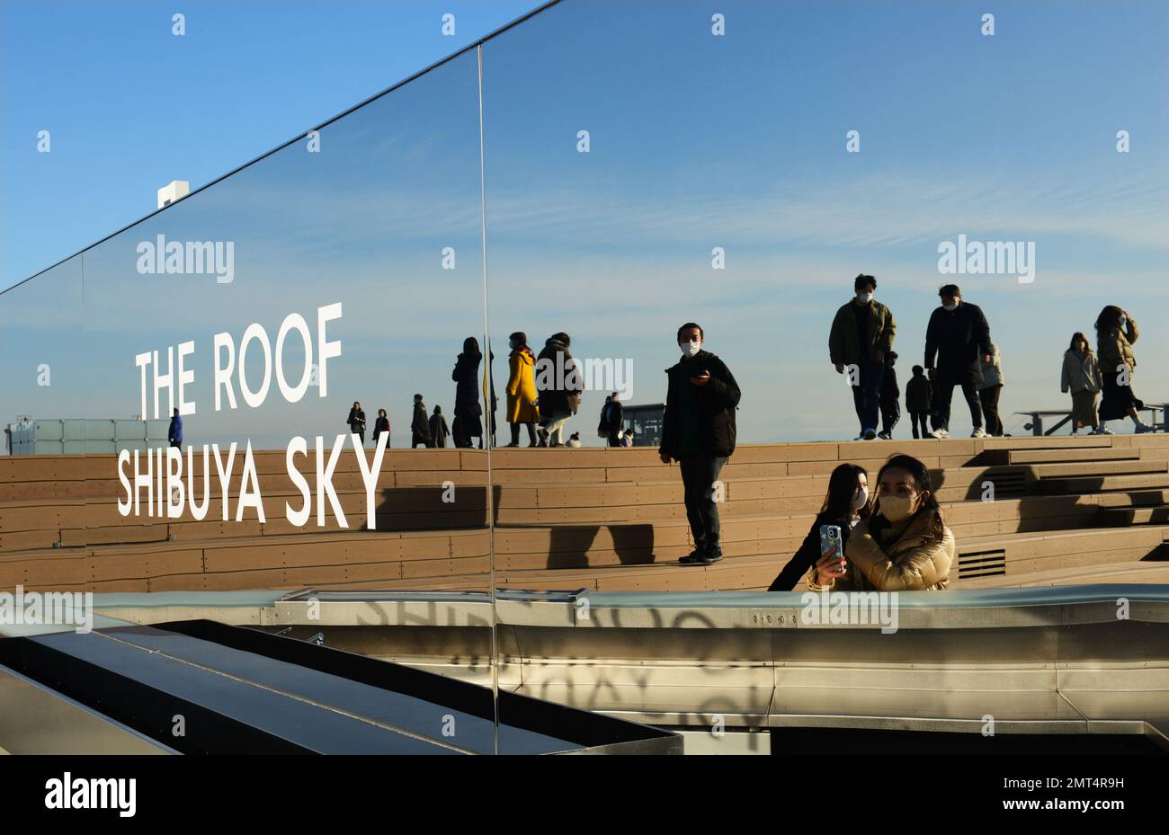 Tourist enjoying the views from the Shibuya Sky rooftop observation ...