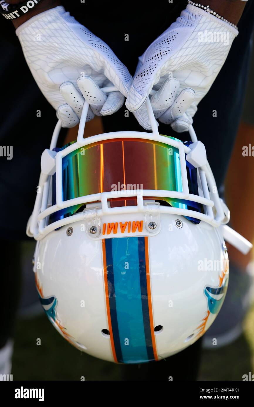 Miami Dolphins cornerback Tony Lippett holds his helmet as he speaks to ...