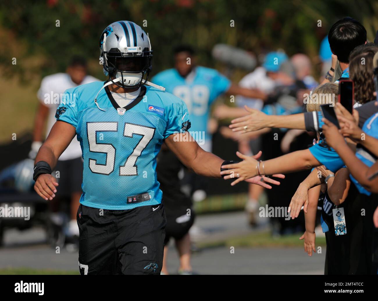 Carolina Panthers' Jeremy Cash (57) greets fans before practice at ...