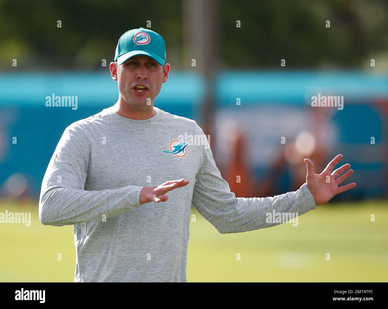 Miami Dolphins head coach Adam Gase talks to players during an NFL ...