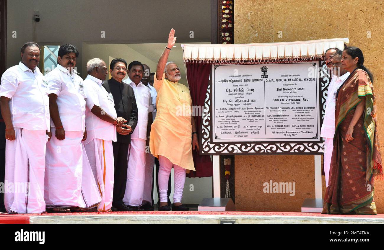 Indian Prime Minister Narendra Modi, center, waves to a crowd after ...