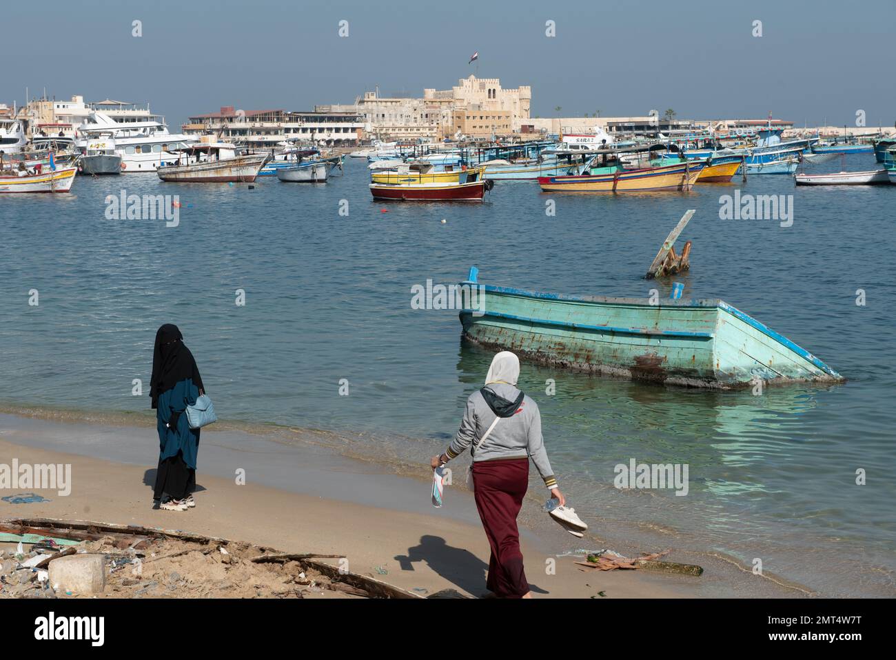 Alexandria, Egypt. December 1st 2022 Two Muslim women walk on the beach ...