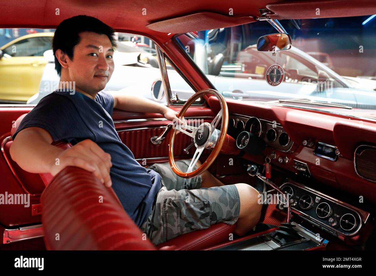 In this Wednesday, June 28, 2017, photo, Guo Xin sits in his 1966 MT GT ...