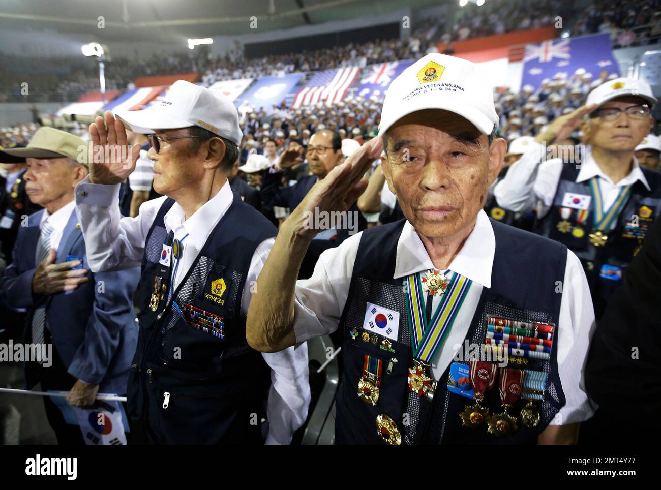 South Korean War veterans salute during a commemorative ceremony ...