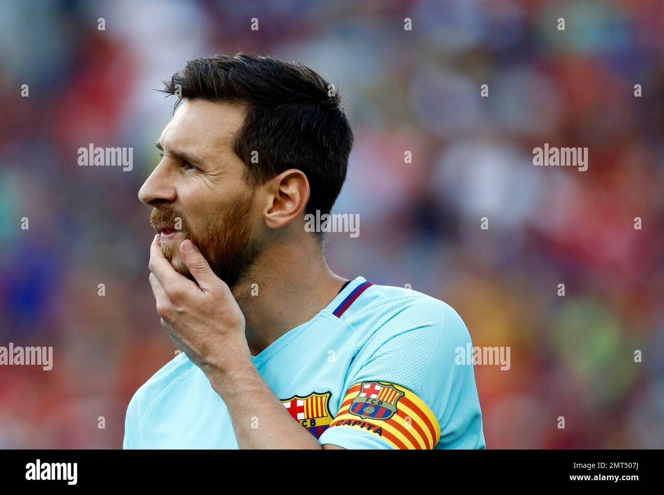Barcelona midfielder Lionel Messi walks on the field before an ...