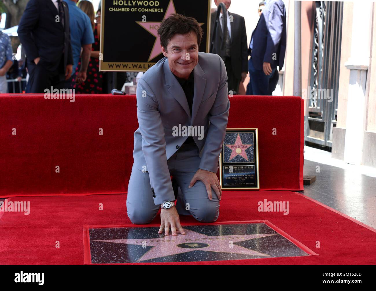 Jason Bateman touches his star at a ceremony honoring him with a star ...