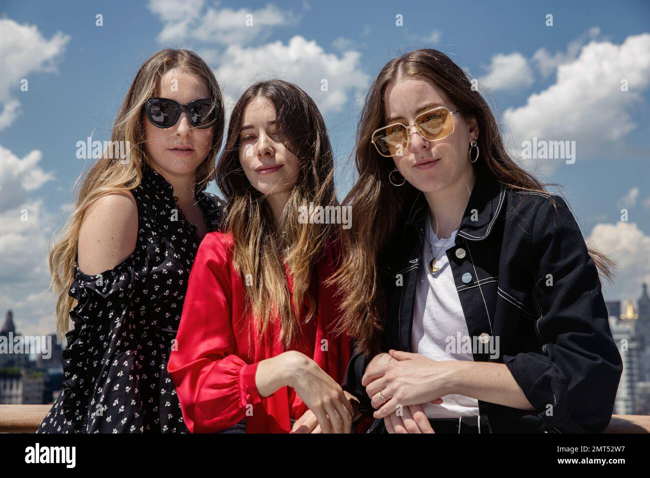 In this June 27, 2017 photo, Este Haim, from left, Danielle Haim and Alana Haim of Haim pose for ...