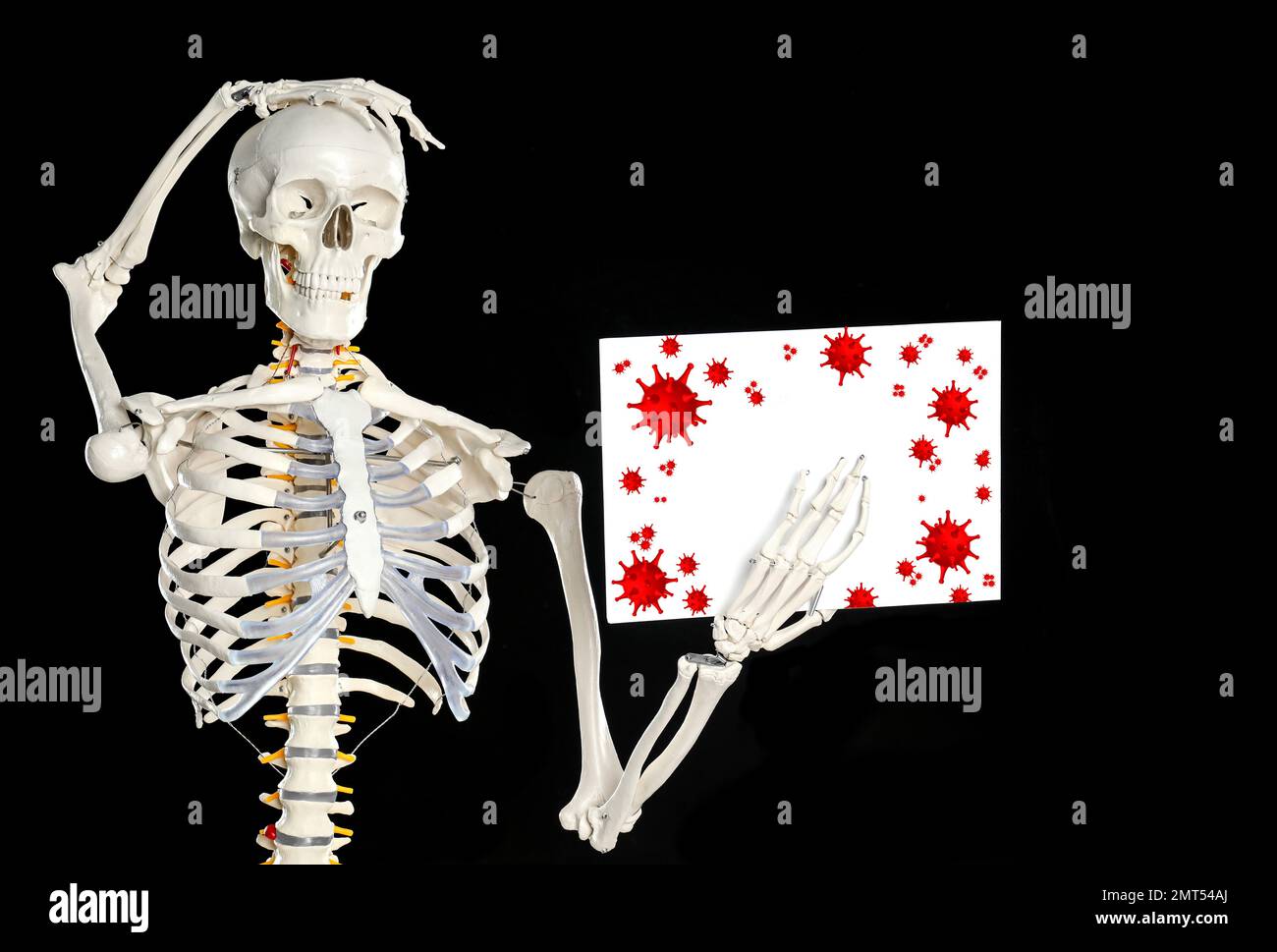 Artificial human skeleton with illustration of virus on black ...