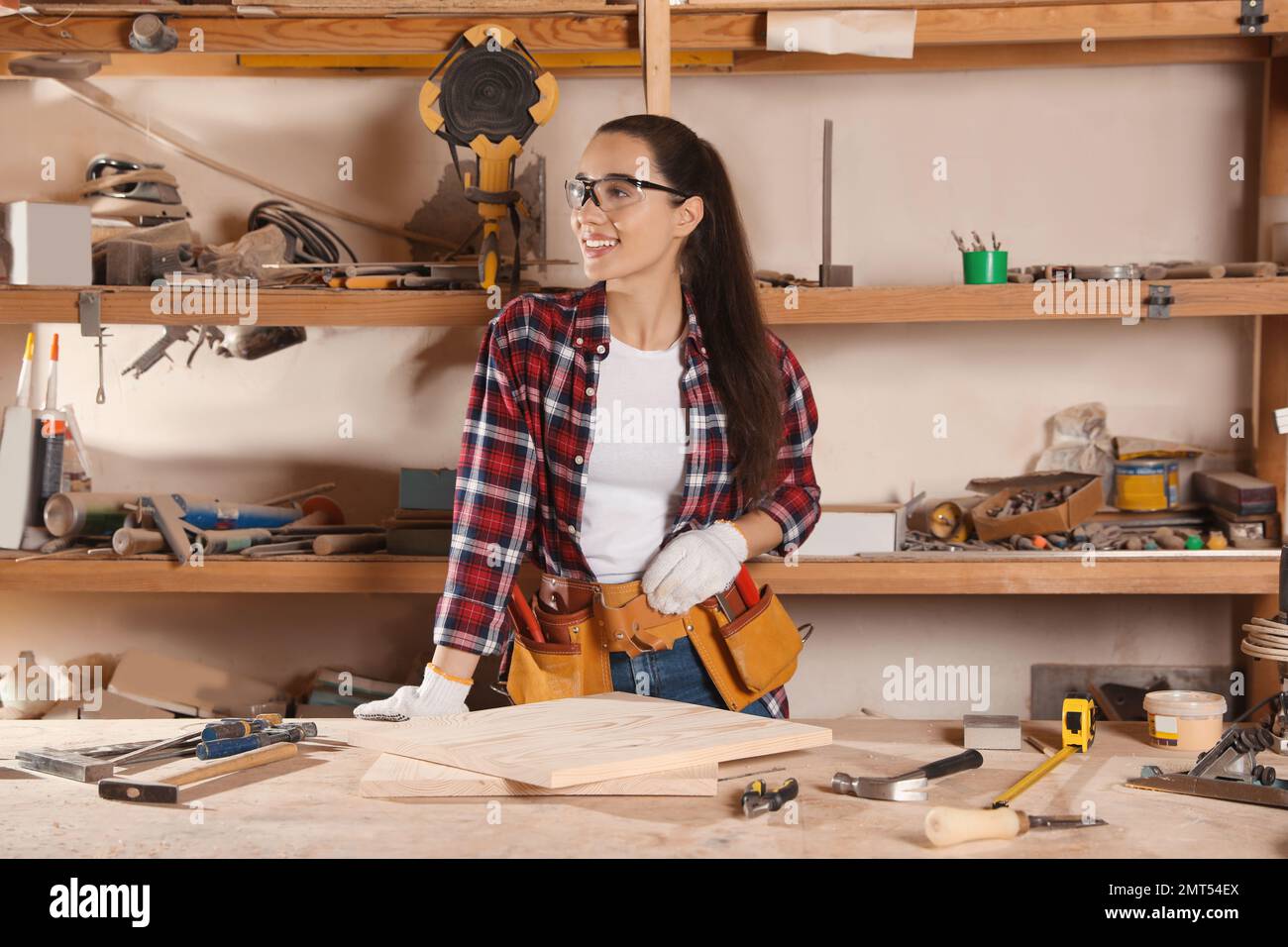 Professional carpenter with set of tools in workshop Stock Photo - Alamy