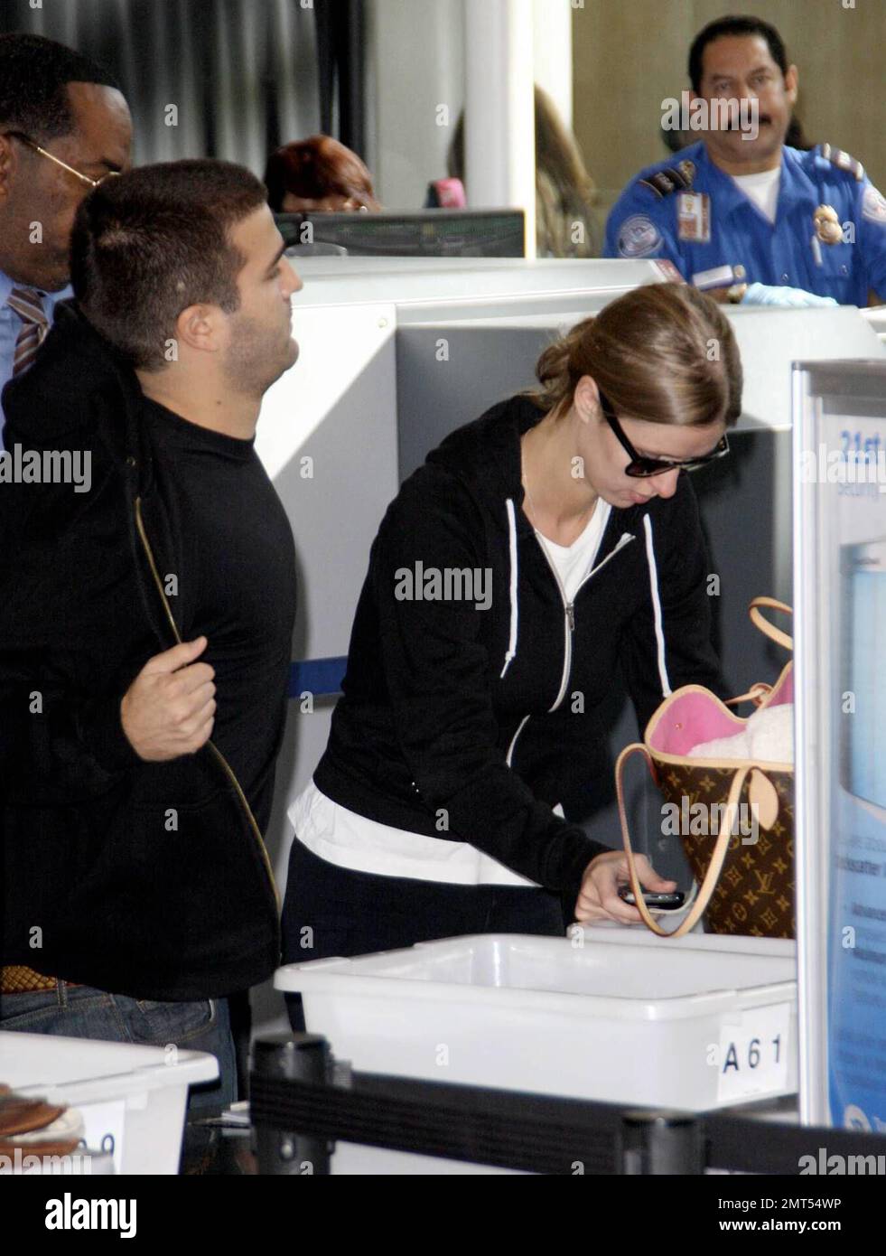 Nicky Hilton and boyfriend David Katzenberg head through the security ...