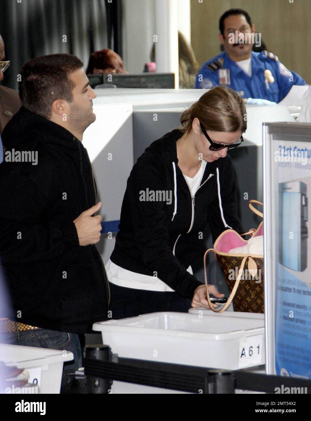 Nicky Hilton and boyfriend David Katzenberg head through the security ...