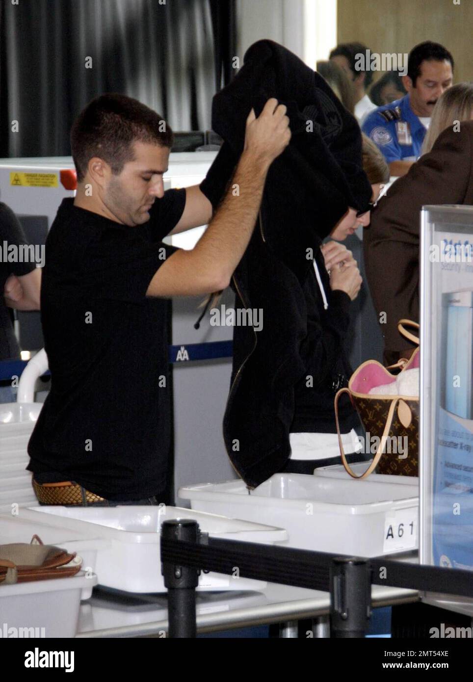 Nicky Hilton and boyfriend David Katzenberg head through the security ...