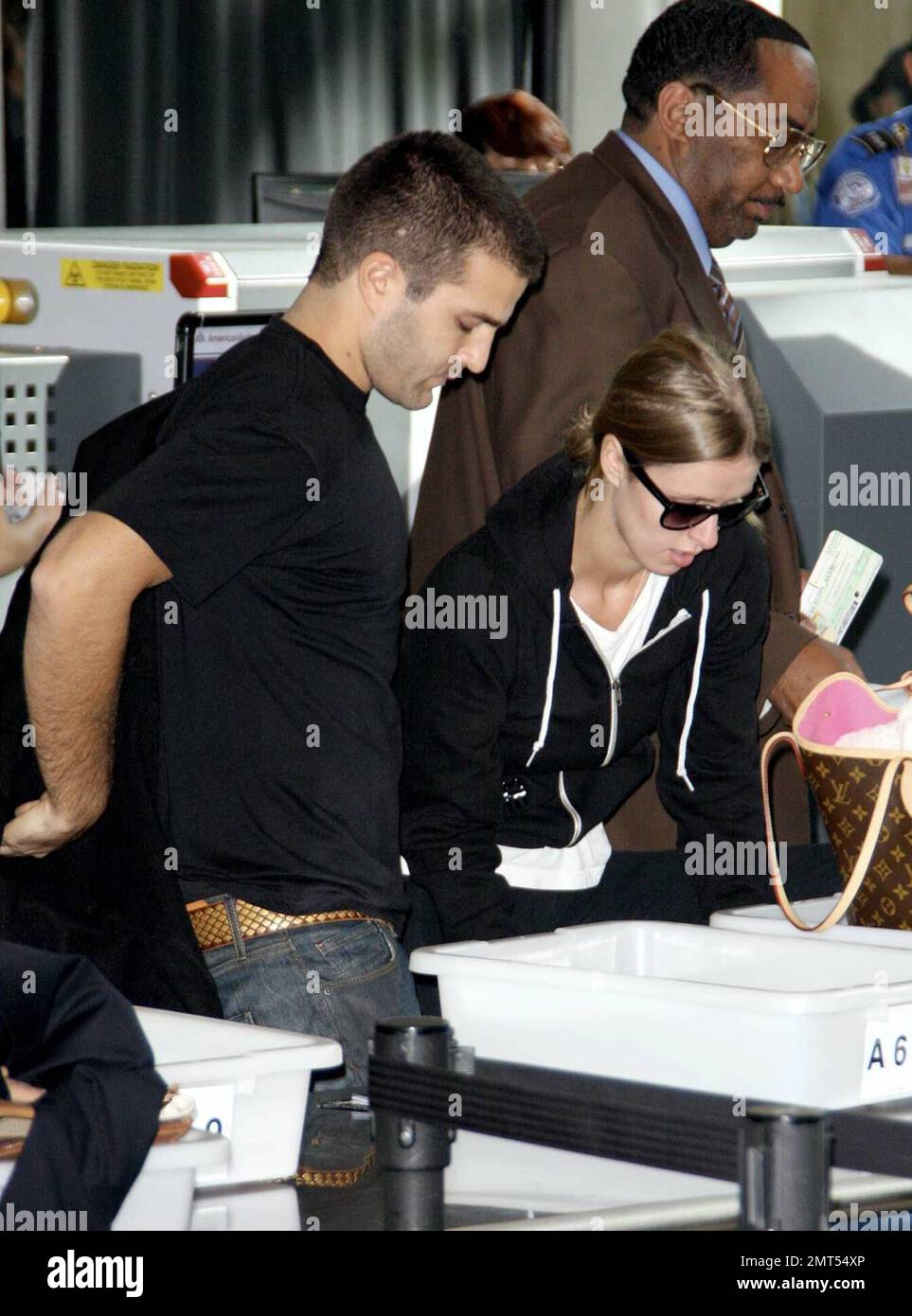 Nicky Hilton and boyfriend David Katzenberg head through the security ...