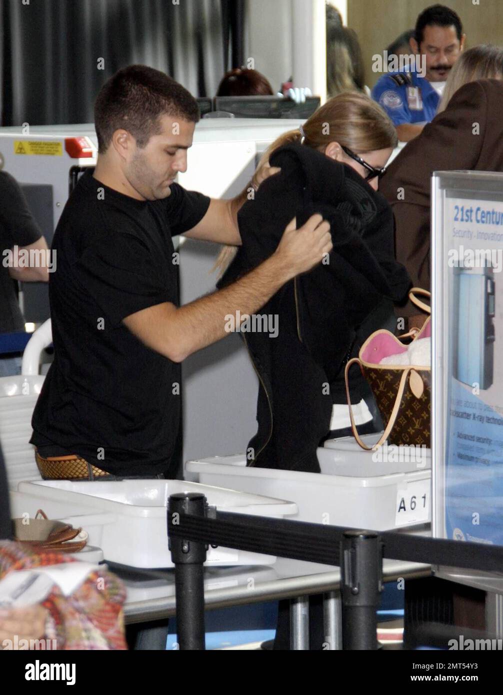 Nicky Hilton and boyfriend David Katzenberg head through the security ...