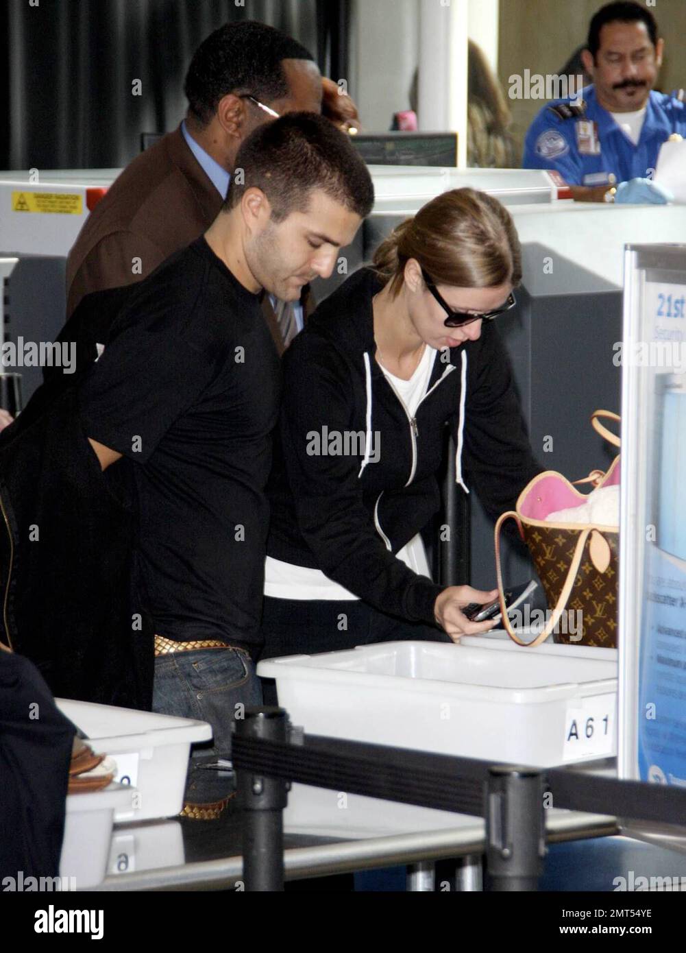 Nicky Hilton and boyfriend David Katzenberg head through the security ...