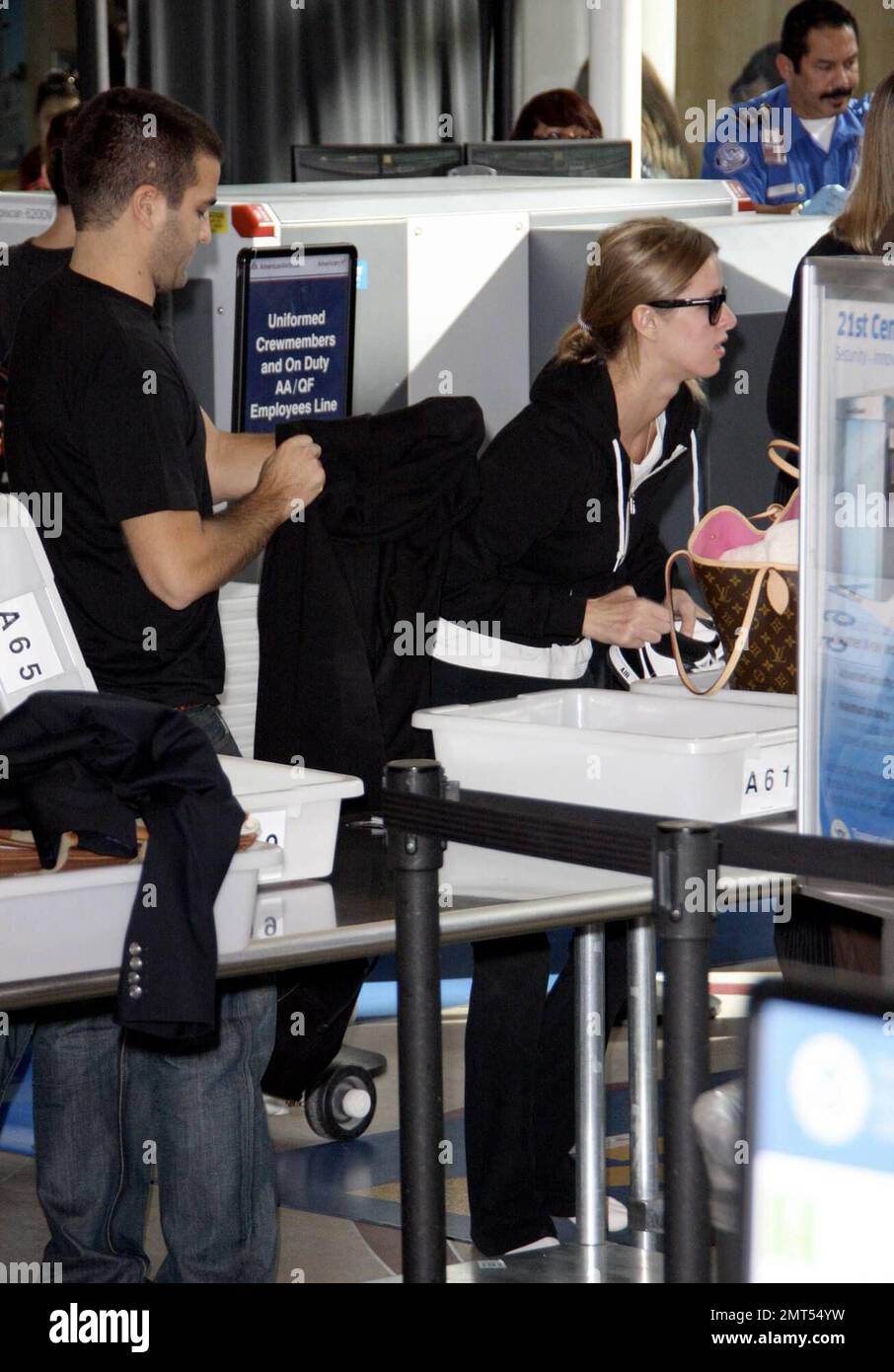 Nicky Hilton and boyfriend David Katzenberg head through the security ...