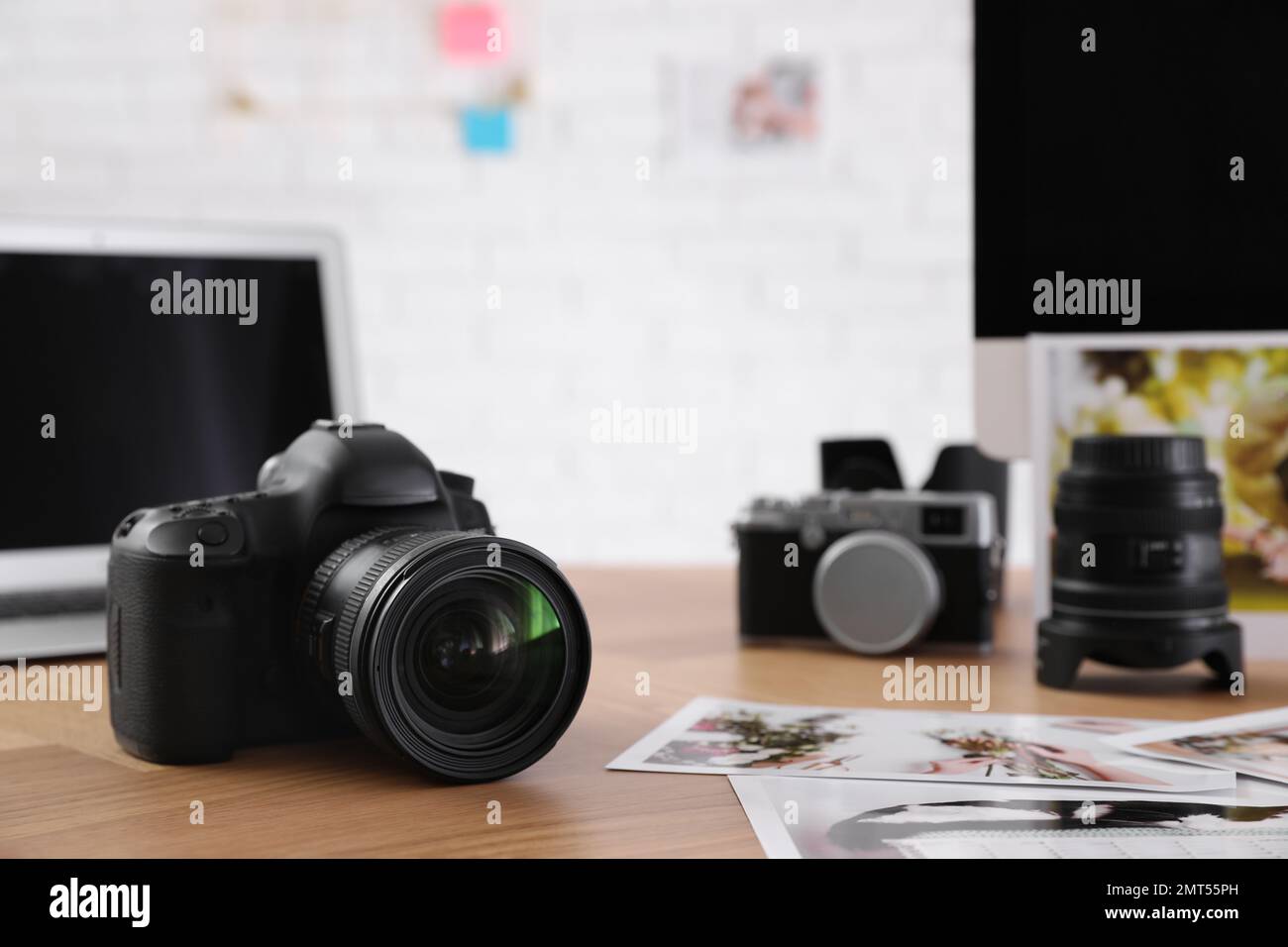 Photographer's workplace with professional camera in office Stock Photo ...