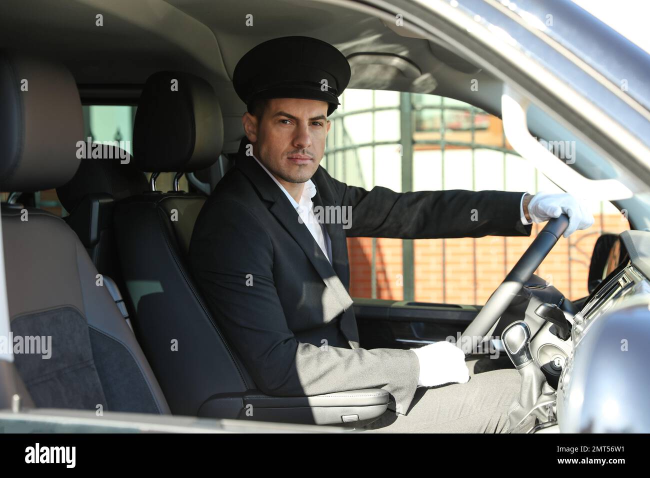 Professional driver in luxury car. Chauffeur service Stock Photo - Alamy