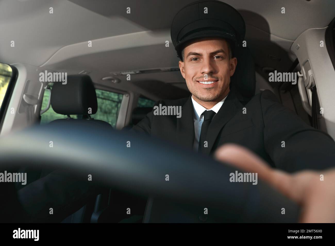 Professional driver in luxury car. Chauffeur service Stock Photo - Alamy