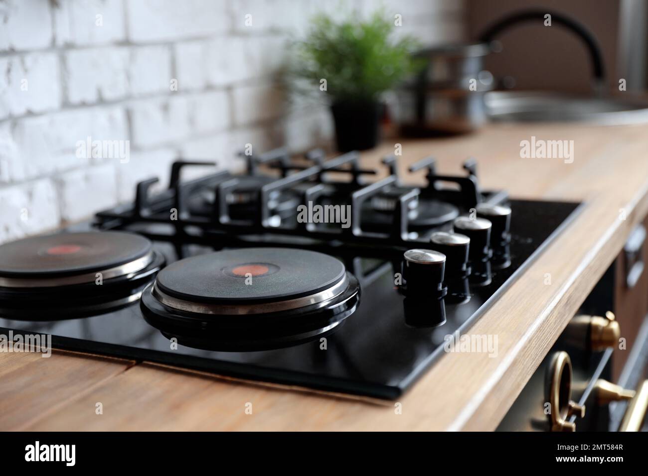 New modern stove with gas and electric burners in kitchen Stock Photo ...