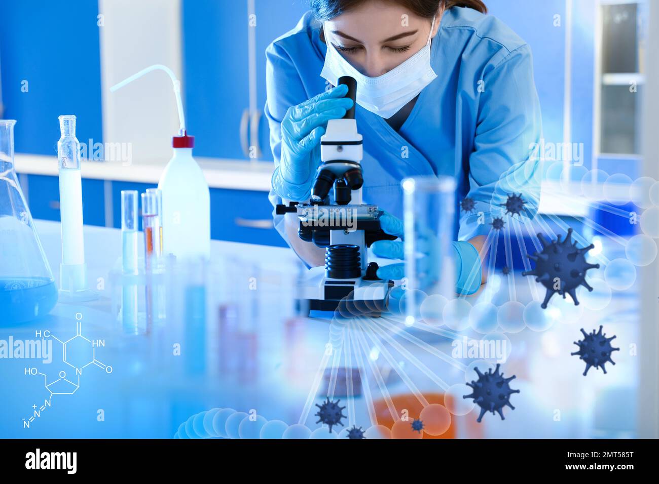 Scientist using modern microscope at table in laboratory. Researching ...