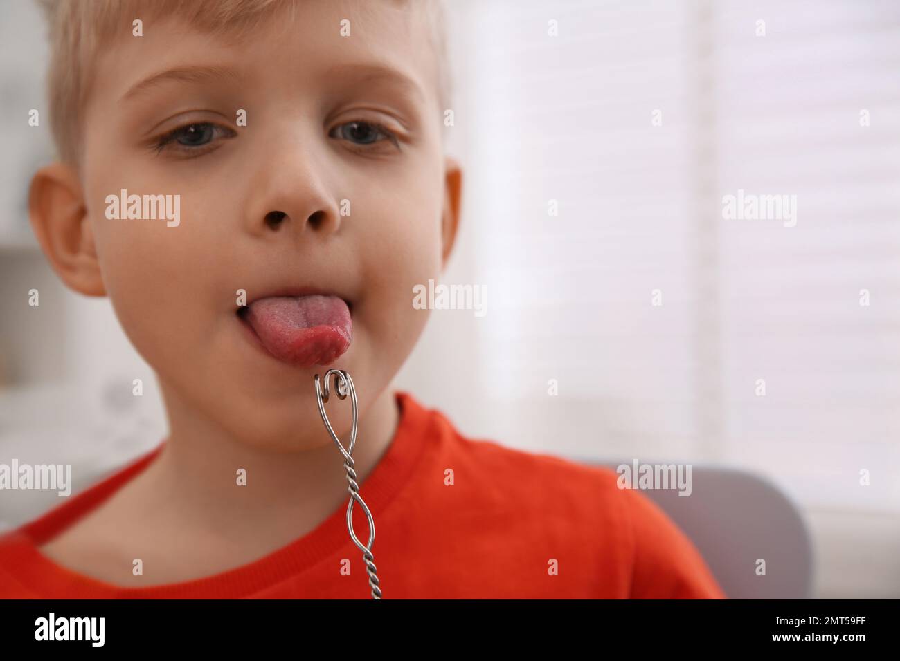 Little boy doing exercise with logopedic probe at speech therapist ...