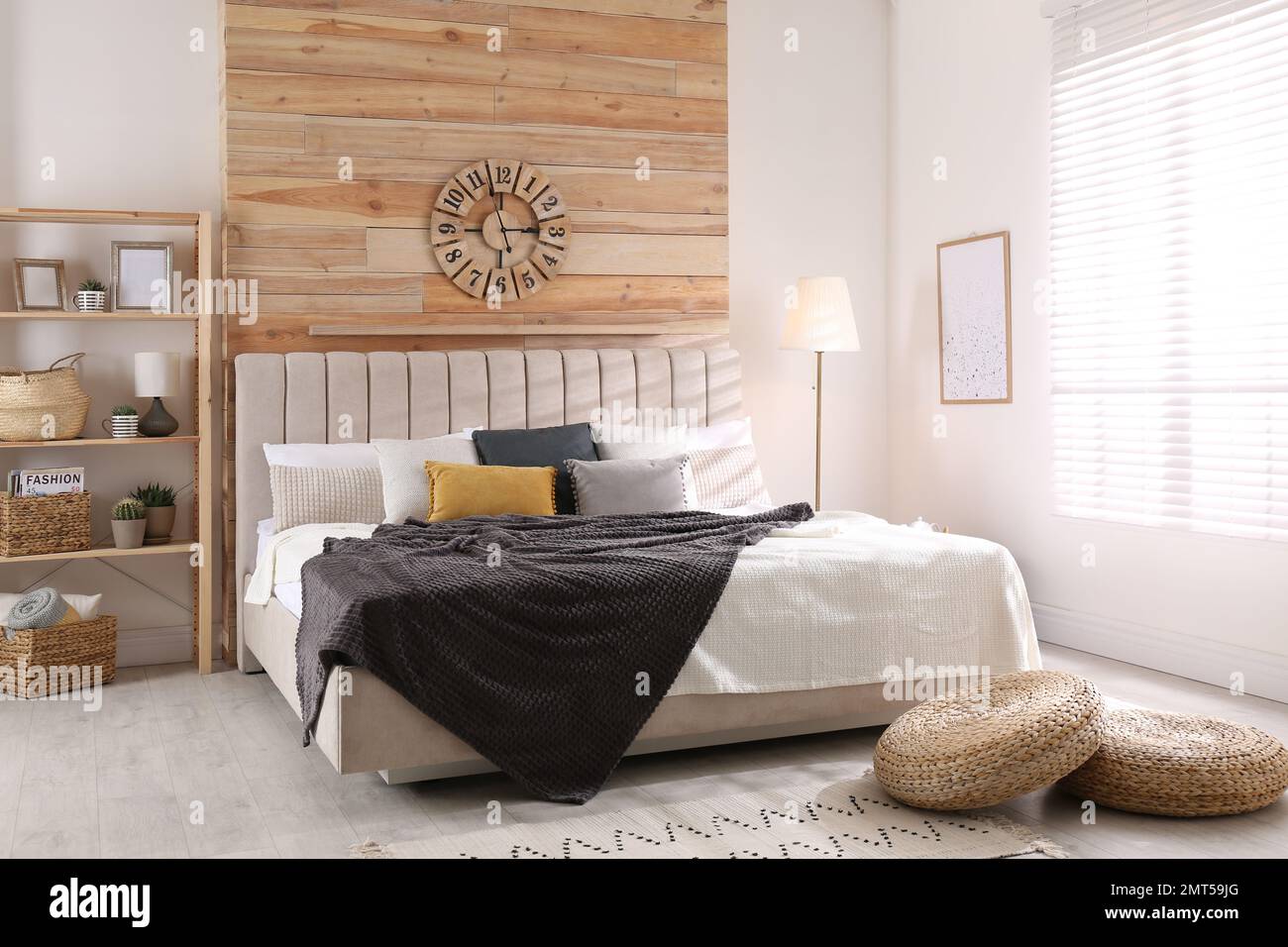 Stylish room interior with big comfortable bed Stock Photo - Alamy