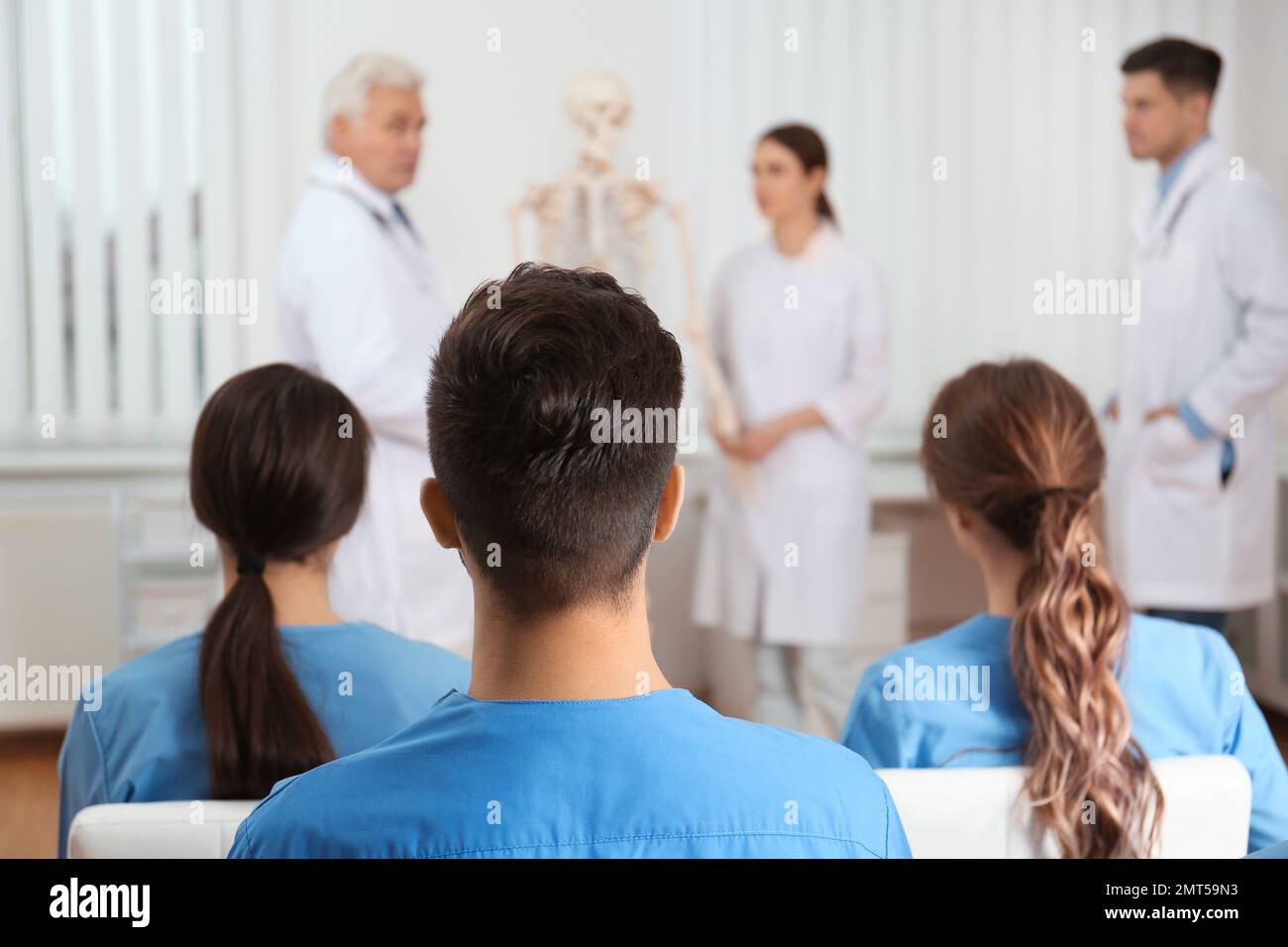 Medical students having lecture in orthopedics at clinic Stock Photo ...