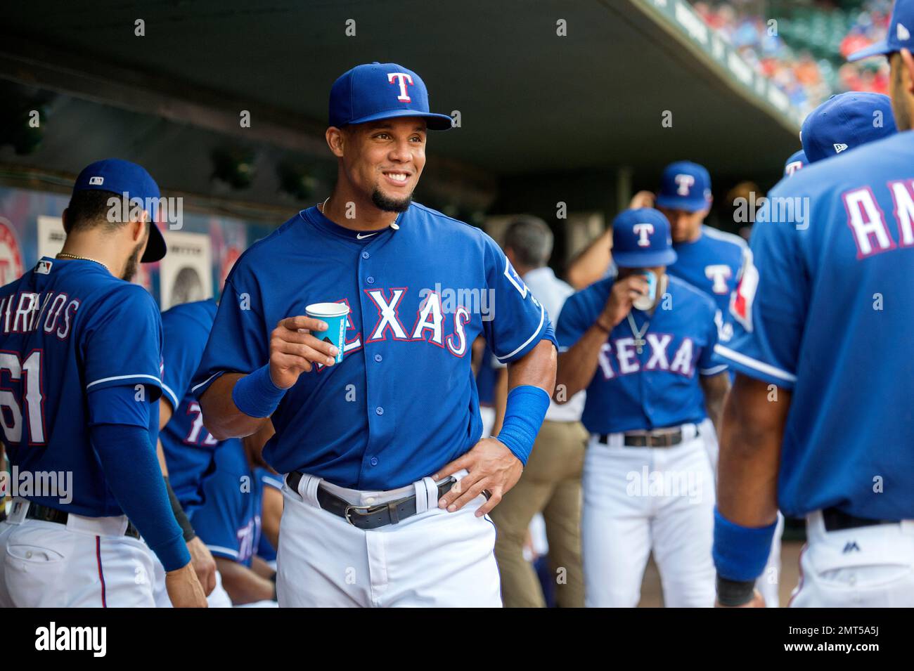 Texas Rangers center fielder Carlos Gomez (14) smiles in the dugout ...