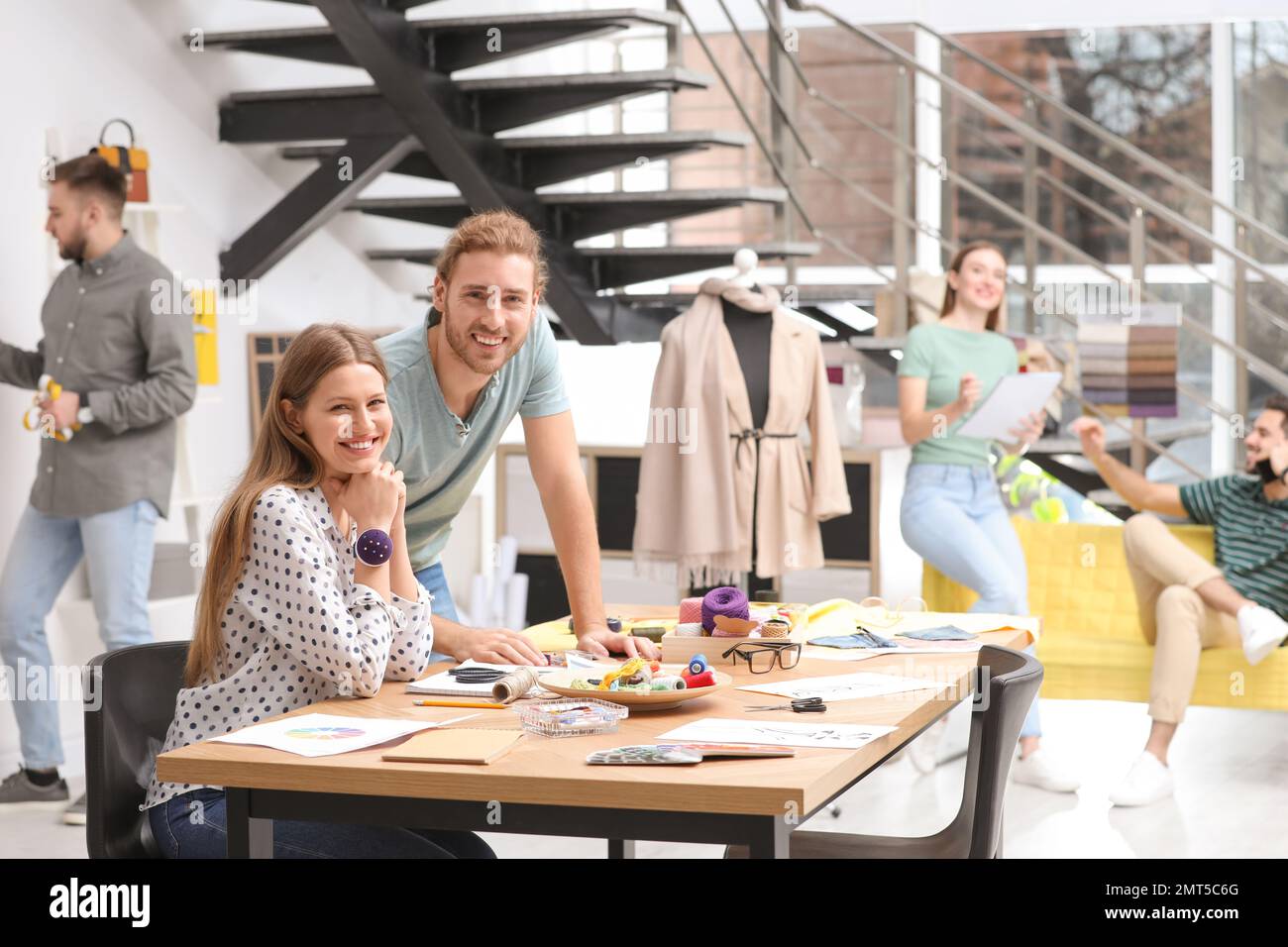 Fashion designers creating new clothes in studio Stock Photo - Alamy