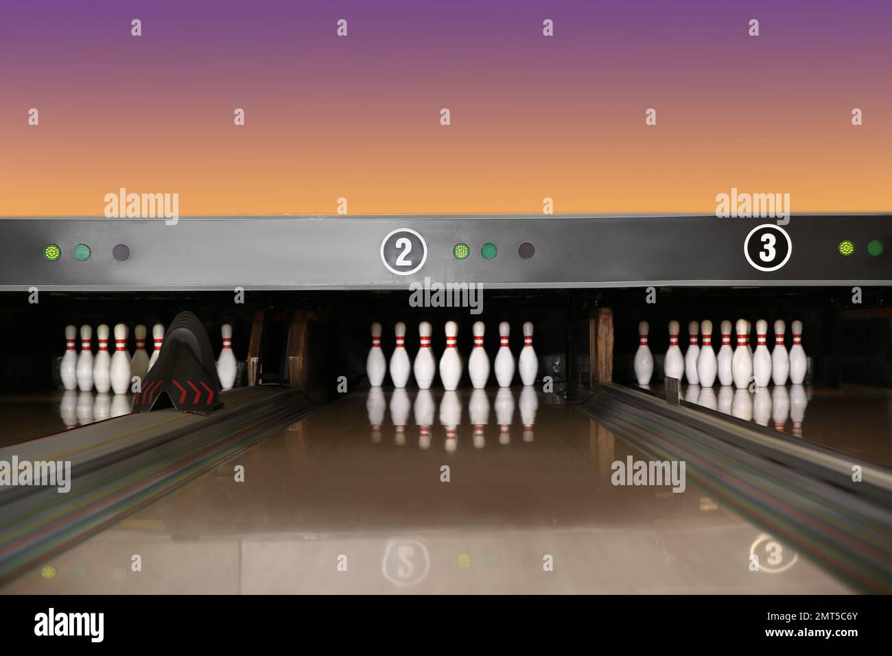 Bowling alley lanes with pins in club Stock Photo - Alamy