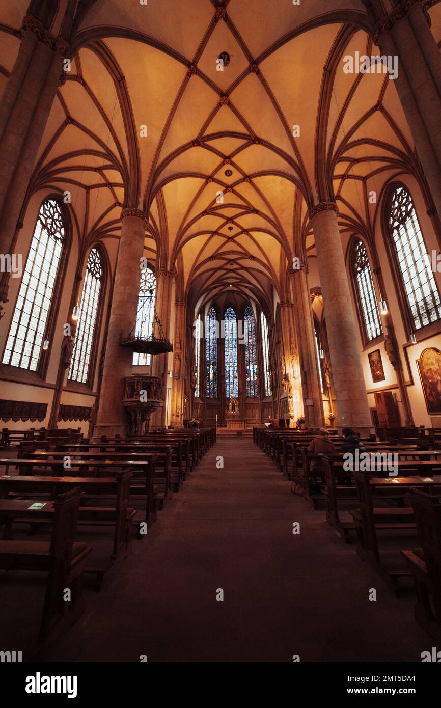 A vertical inside view of a catholic church Stock Photo - Alamy