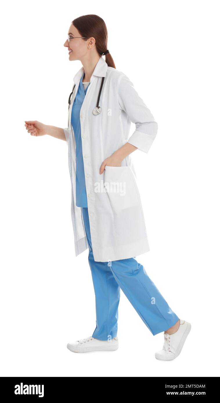 Doctor in clean uniform walking on white background Stock Photo - Alamy