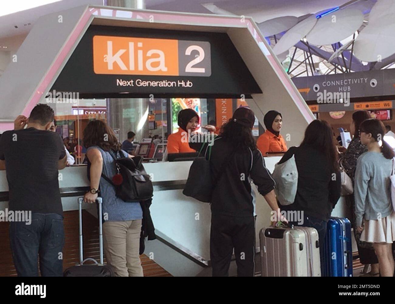 In this Wednesday, Feb. 15, 2017, photo, passengers line up at the ...