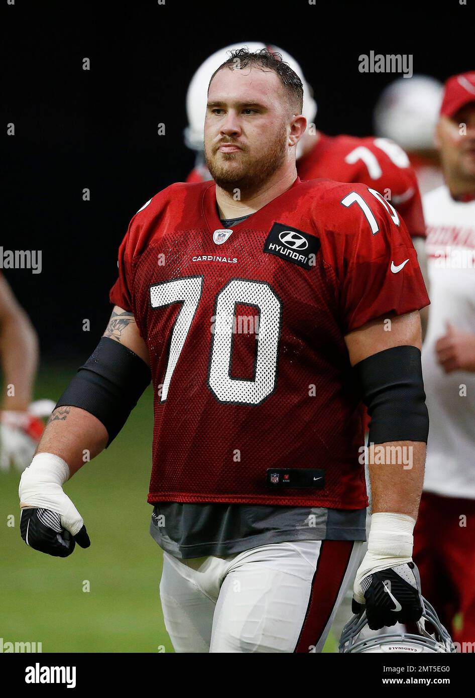 Arizona Cardinals offensive lineman Evan Boehm pauses on the field ...