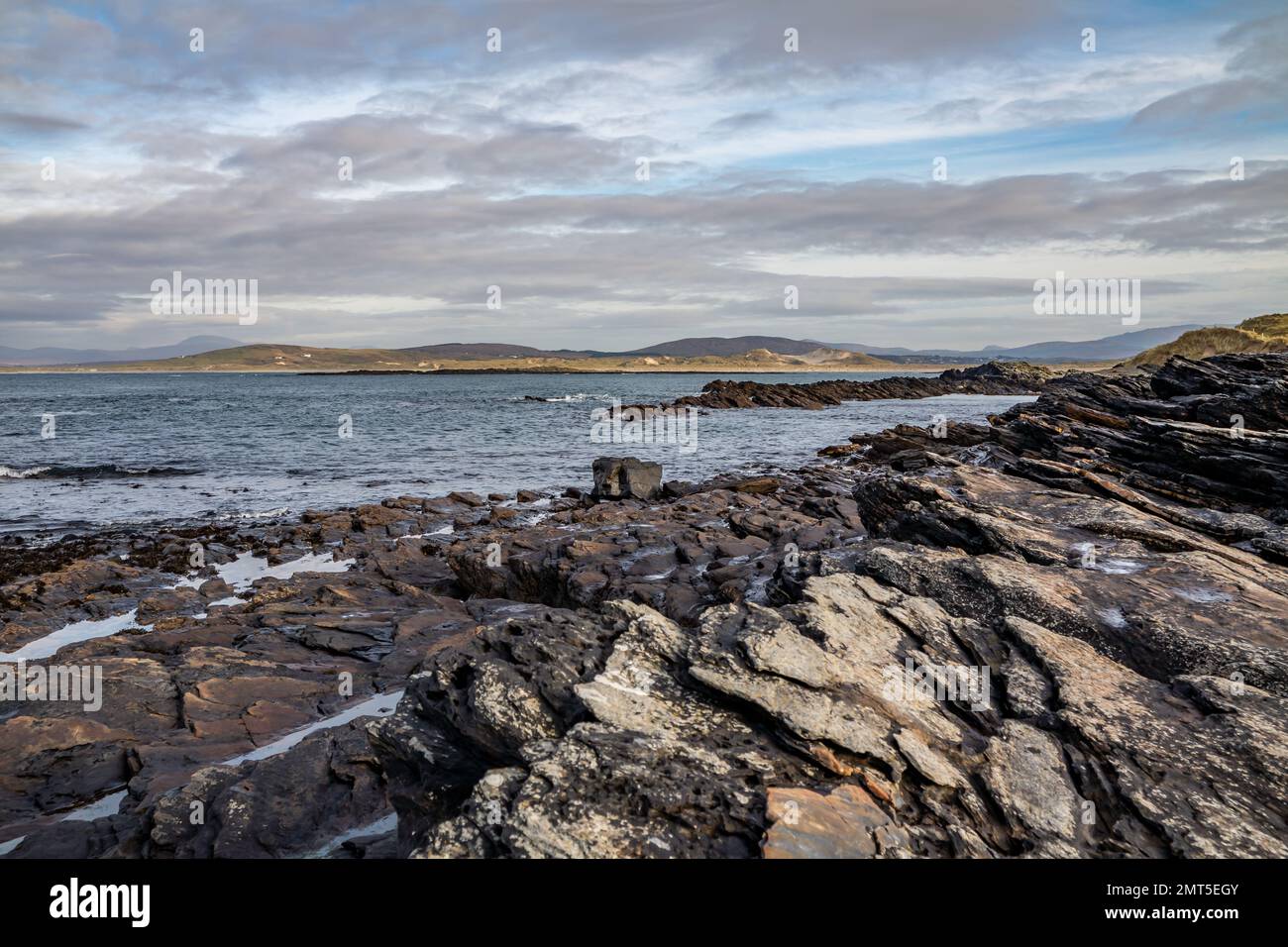The rocks of Carrickfad by Portnoo at Narin Strand in County Donegal ...
