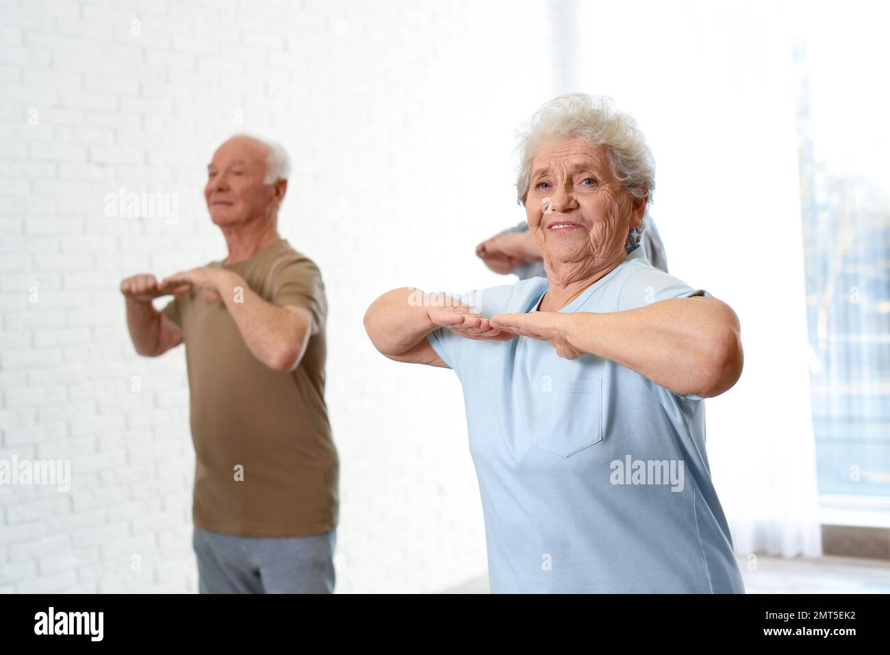Elderly people training in hospital gym. Senior patients care Stock ...