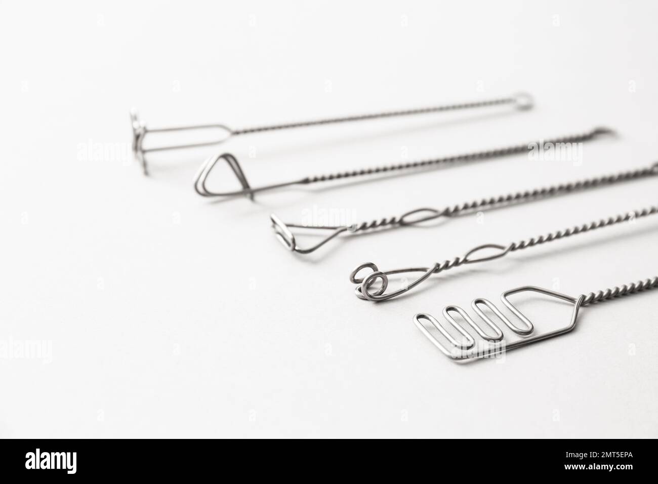 Set of logopedic probes for speech therapy on light grey background ...