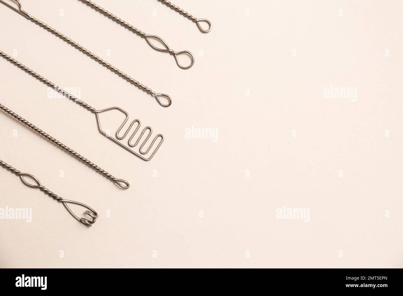 Set of logopedic probes for speech therapy on beige background, flat ...