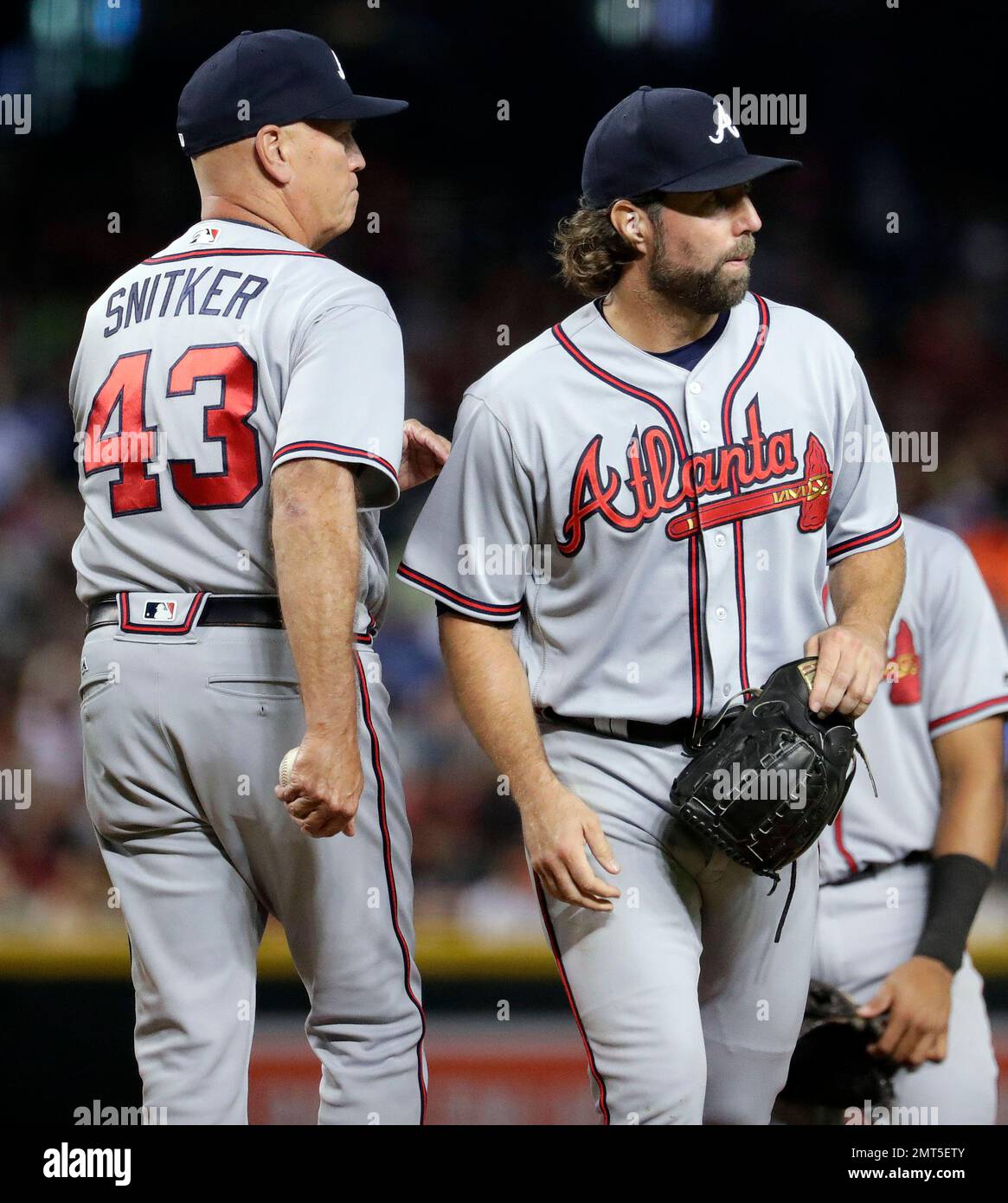 Atlanta Braves starting pitcher R.A. Dickey, right, is pulled from a ...