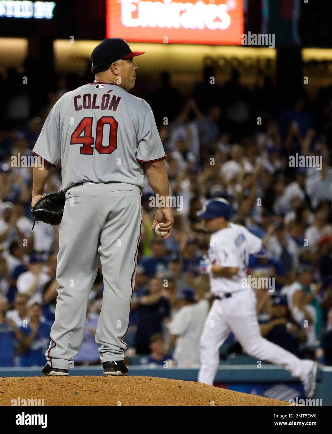 Minnesota Twins starting pitcher Bartolo Colon looks away as Los ...