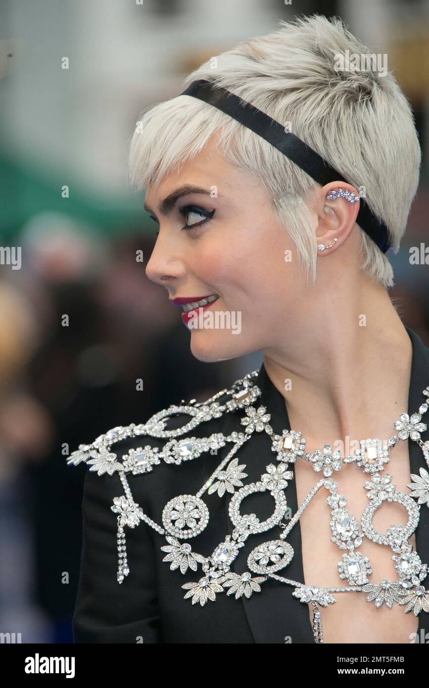 Cara Delevingne poses for photographers as she arrives for the European ...