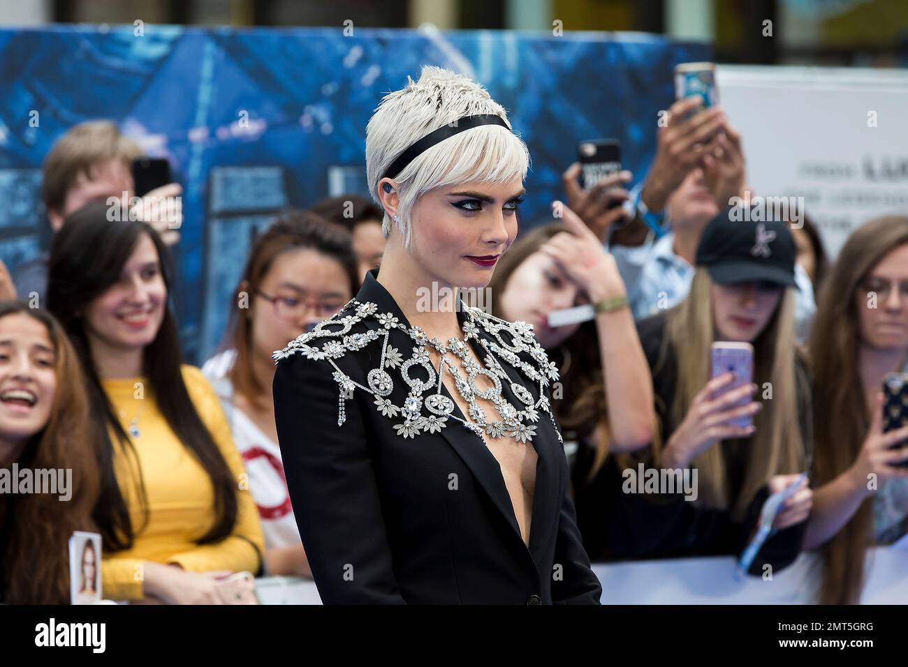 Actress Cara Delevingne poses for photographers on arrival at the ...