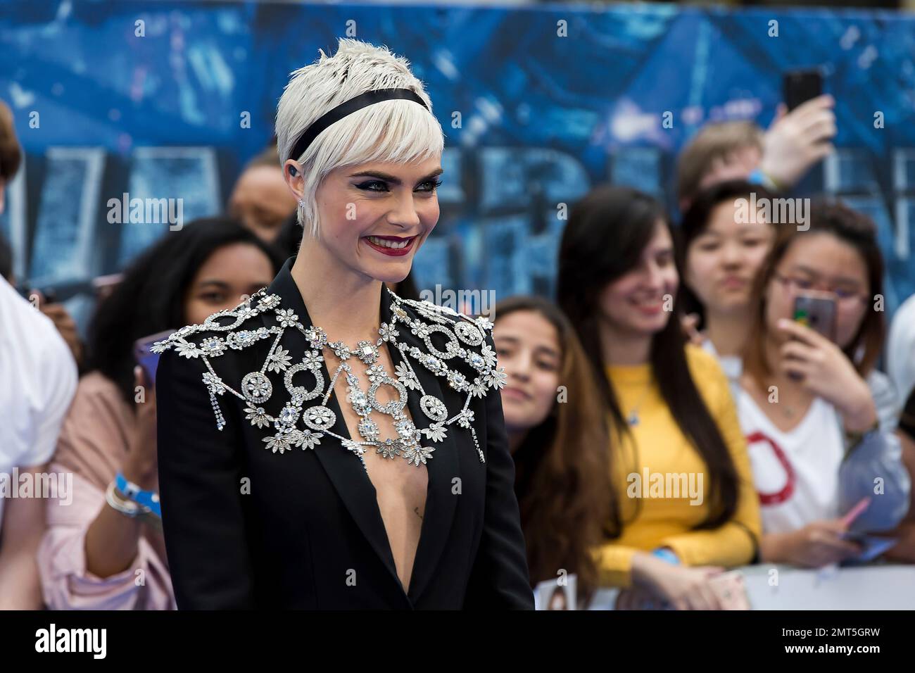 Actress Cara Delevingne poses for photographers on arrival at the ...