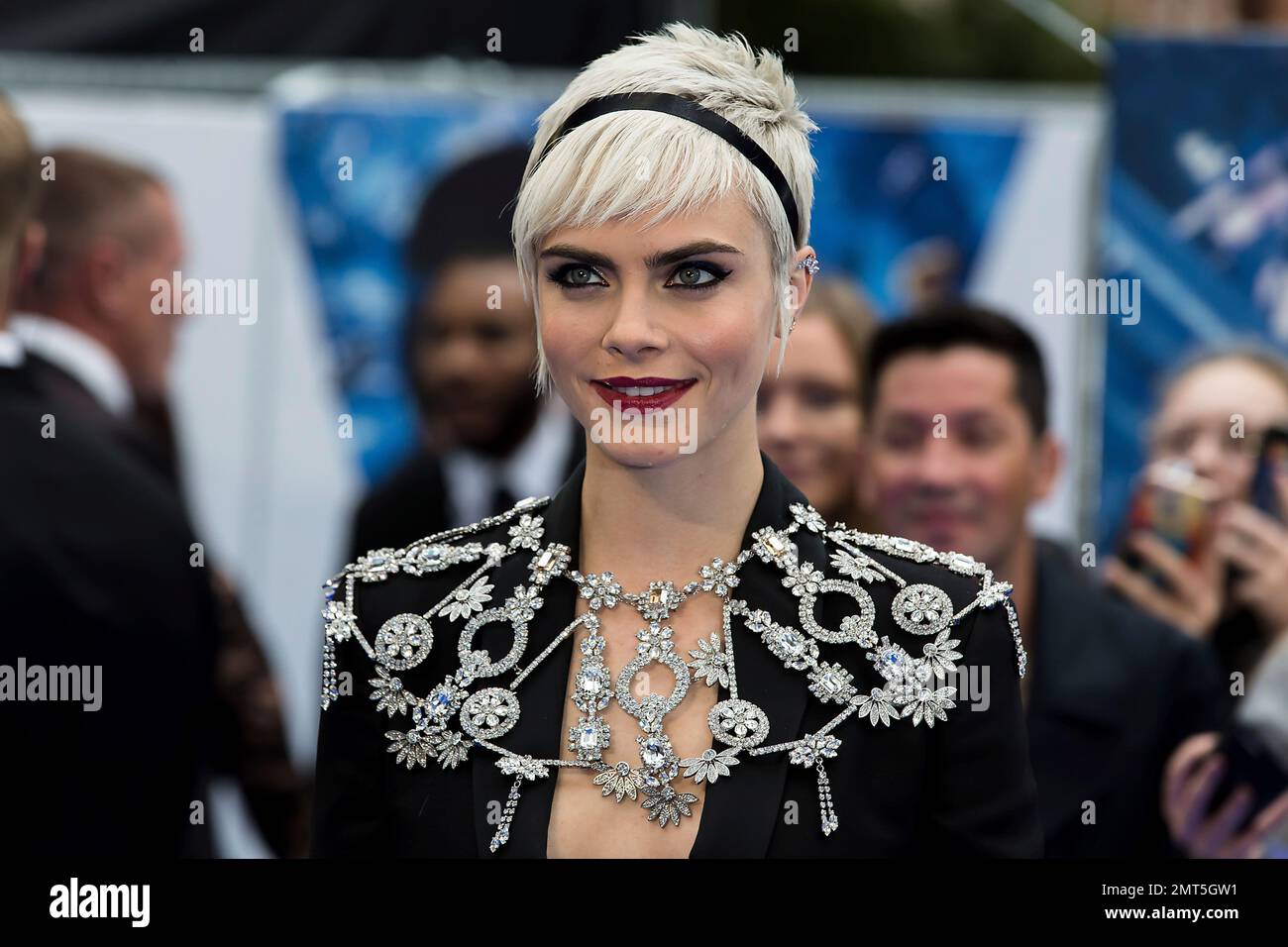 Actress Cara Delevingne poses for photographers on arrival at the ...