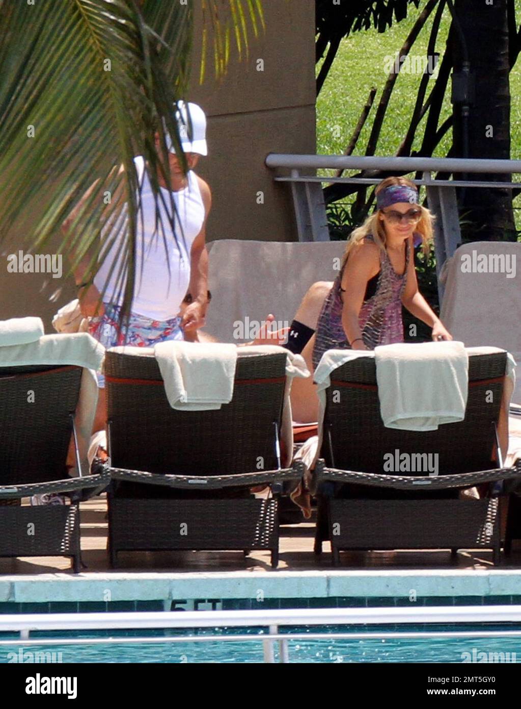 Nicole Richie looks like a hippie chick in a purple headband, purple ...