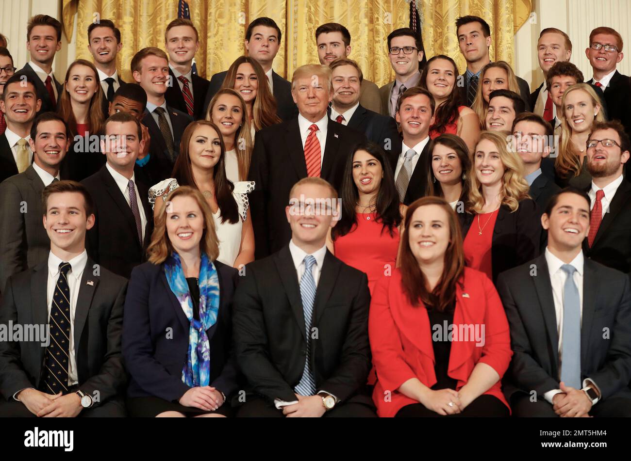 President Donald Trump poses for a photo with outgoing White House ...