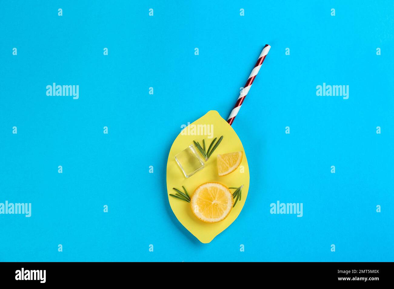 Creative lemonade layout with lemon slices on blue background, top view ...